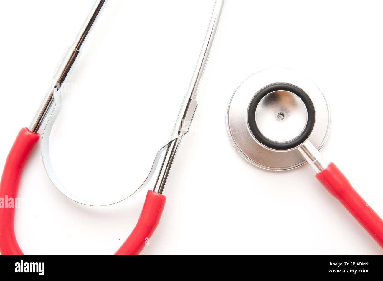 Close -up red stethoscope on white background Stock Photo - Alamy