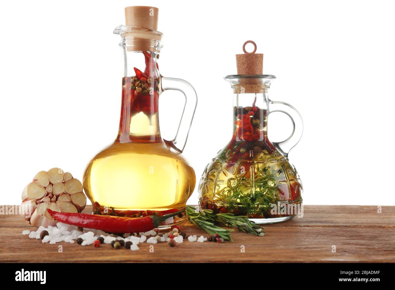Olive oil with spices, isolated on white Stock Photo - Alamy