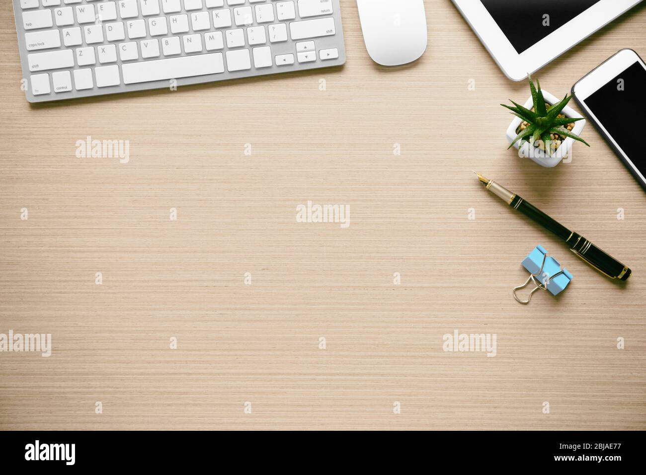 Office tools on wooden background Stock Photo - Alamy
