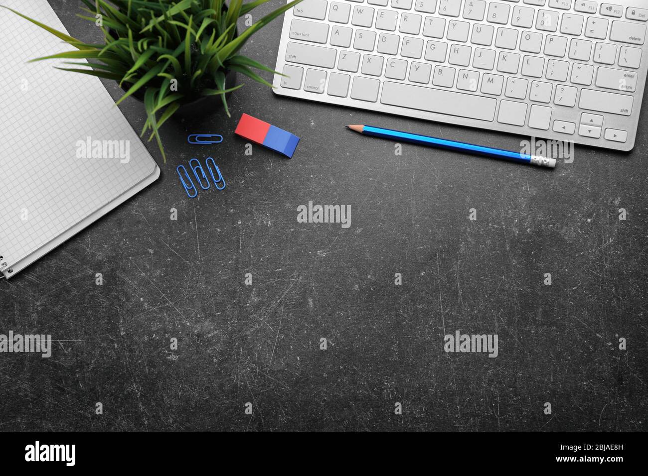 Office tools on gray background Stock Photo - Alamy