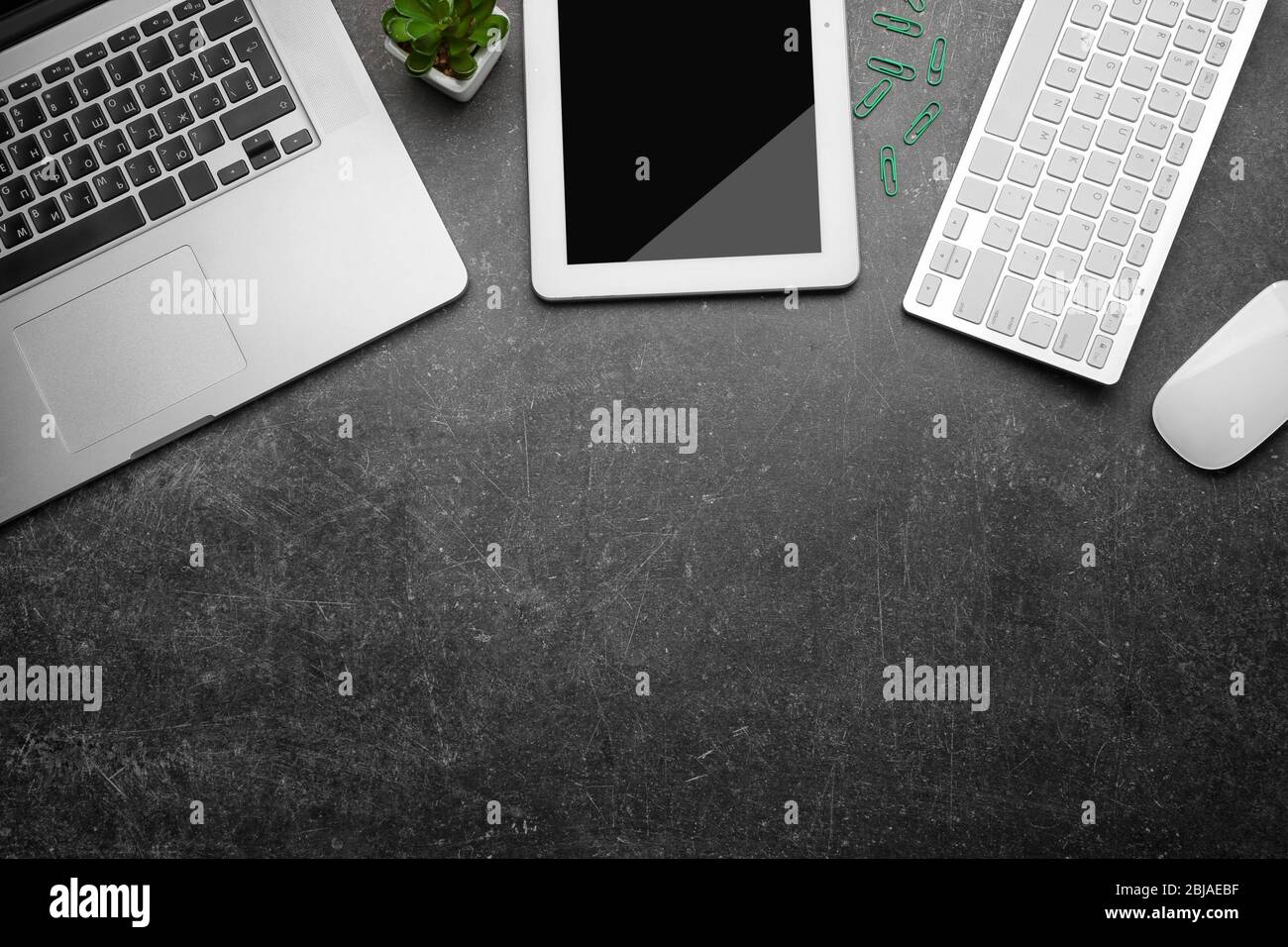 Office tools on gray background Stock Photo - Alamy
