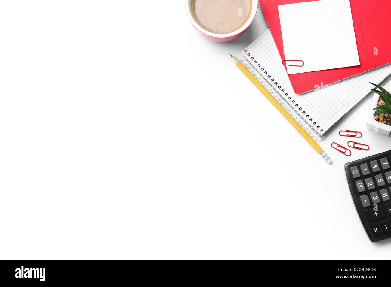 Cup of coffee with office tools on white background Stock Photo - Alamy