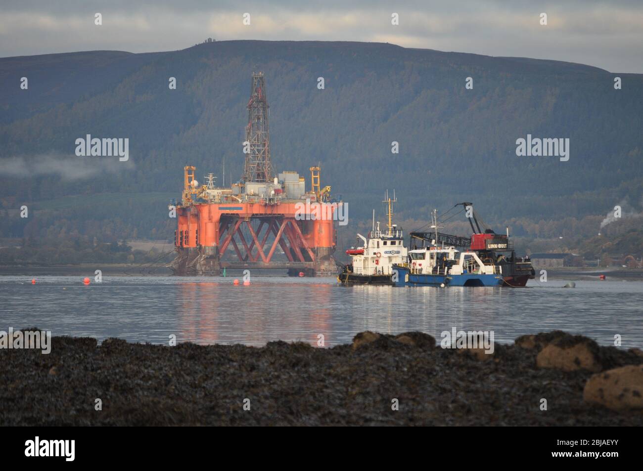 Oil Rig and boat in the Cromarty Firth, Scotland viewed from Balblair ...