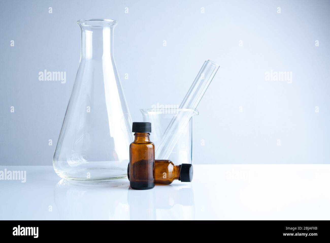 Group of laboratory glassware on table, Symbolic of science research ...