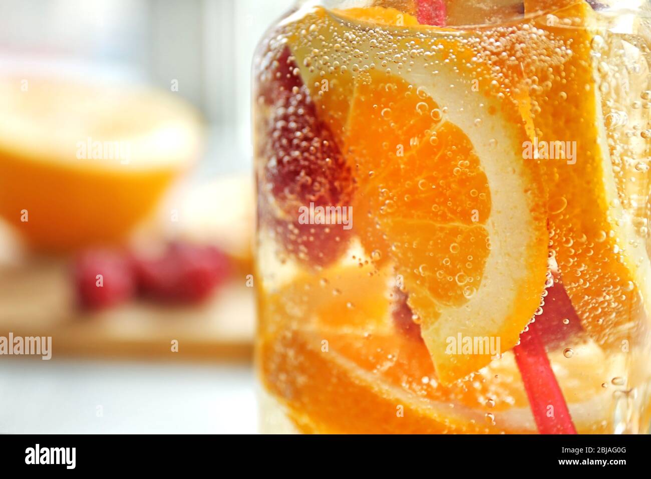 Different fruits with glass of water hi-res stock photography and ...
