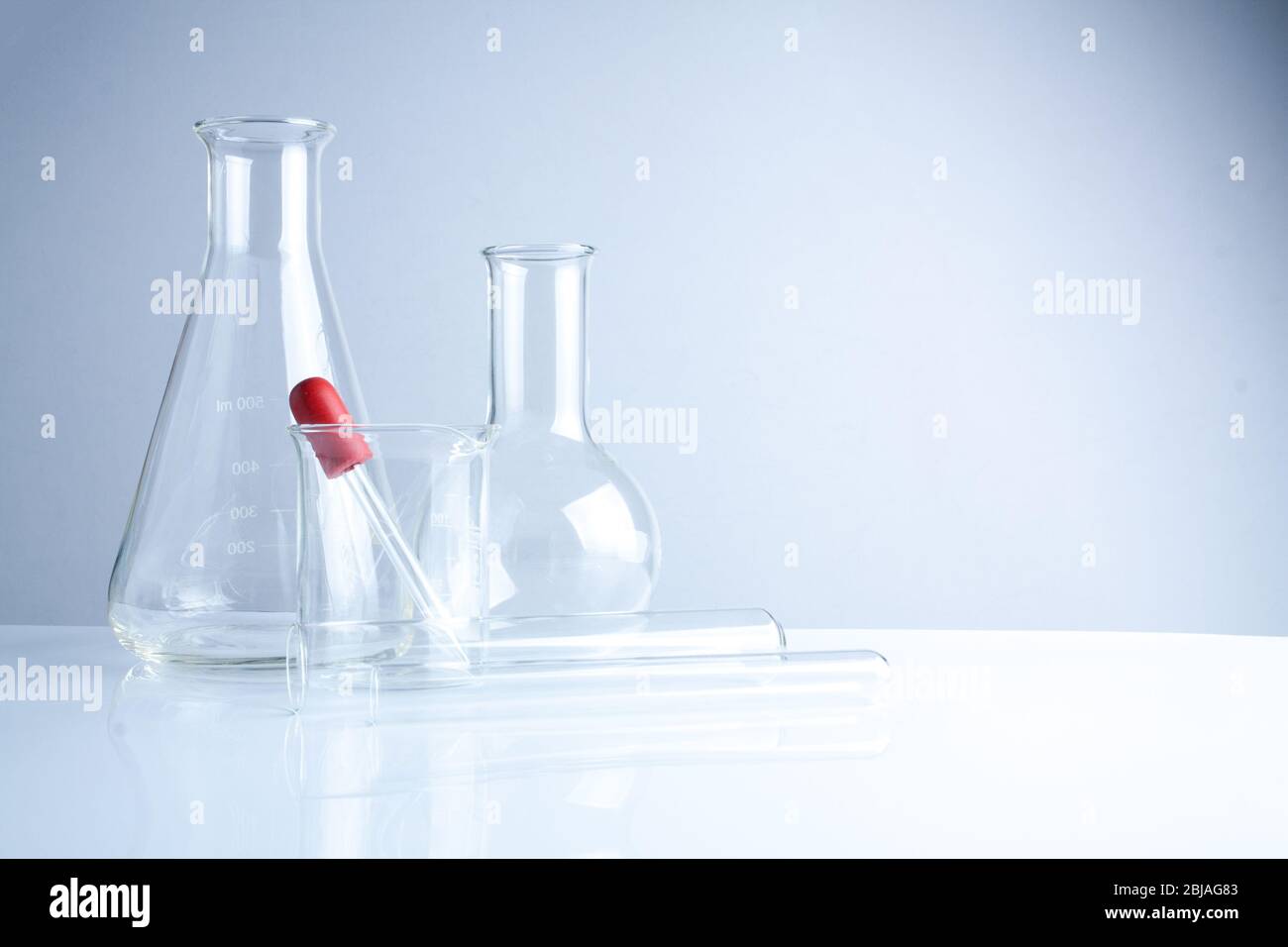 Group of laboratory glassware on table, Symbolic of science research ...