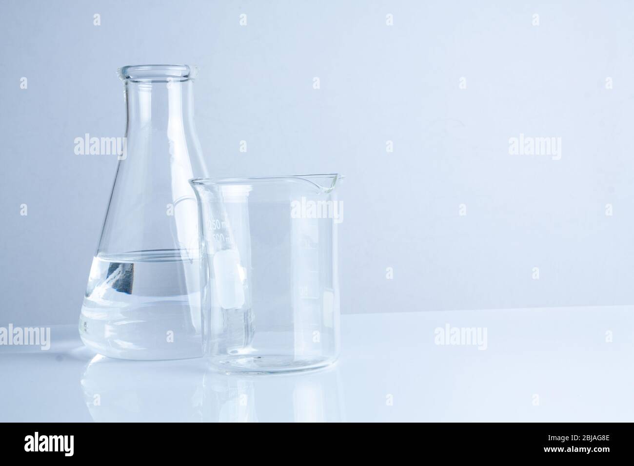 Group of laboratory glassware on table, Symbolic of science research ...