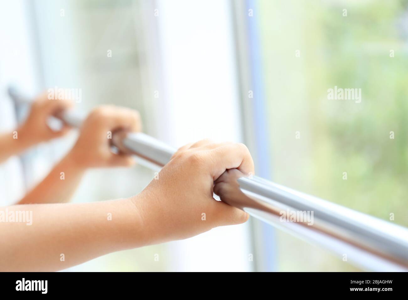 Little ballerinas practicing ballet and holding stick in class Stock ...