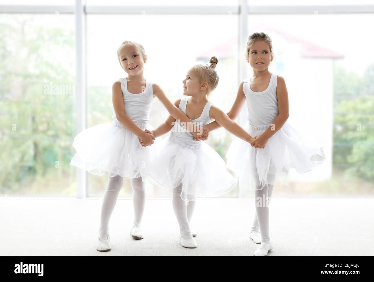 Cute girls practicing ballet in class Stock Photo - Alamy