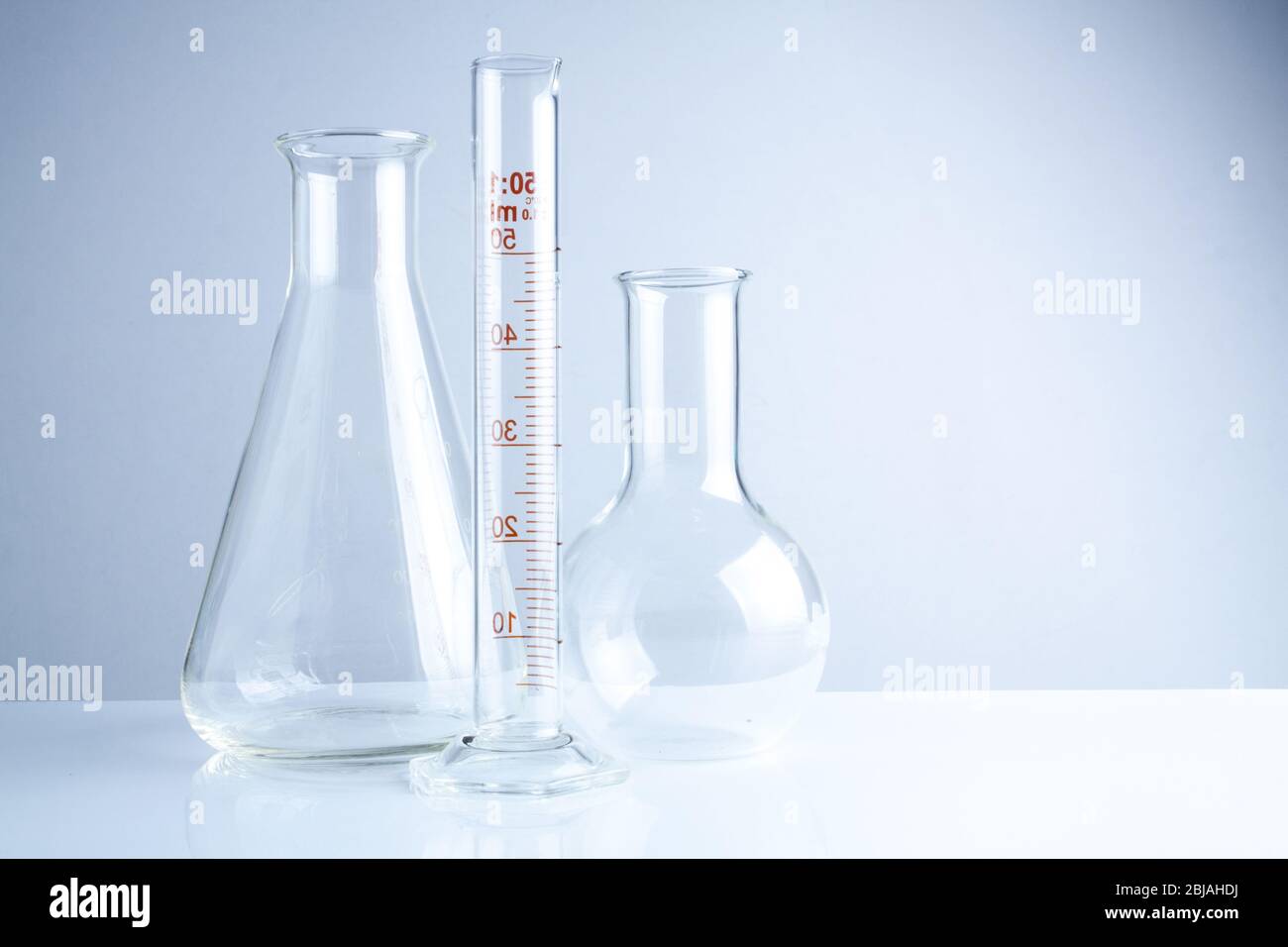 Group of laboratory glassware on table, Symbolic of science research ...