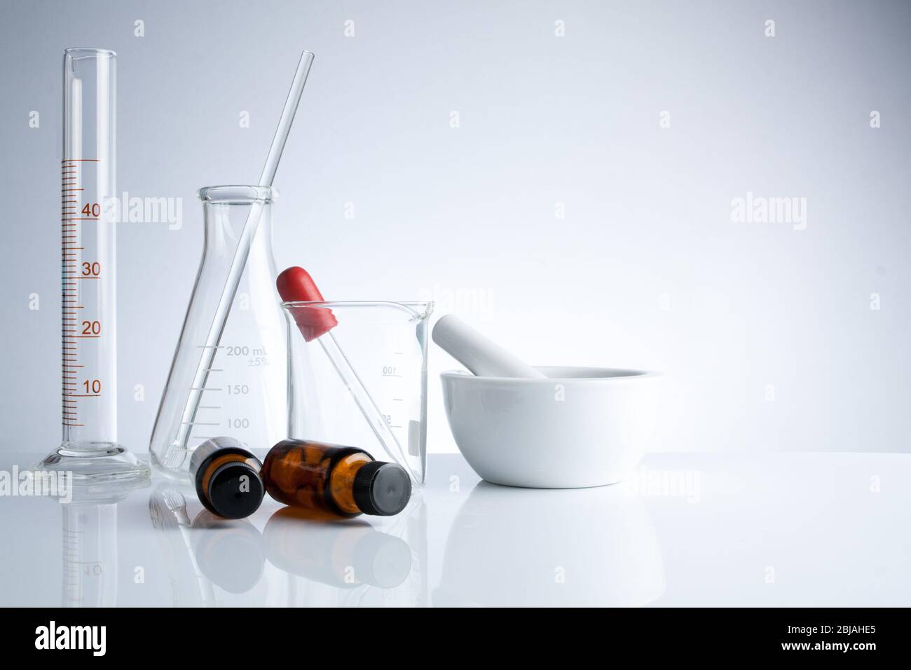 Group of laboratory glassware on table, Symbolic of science research ...