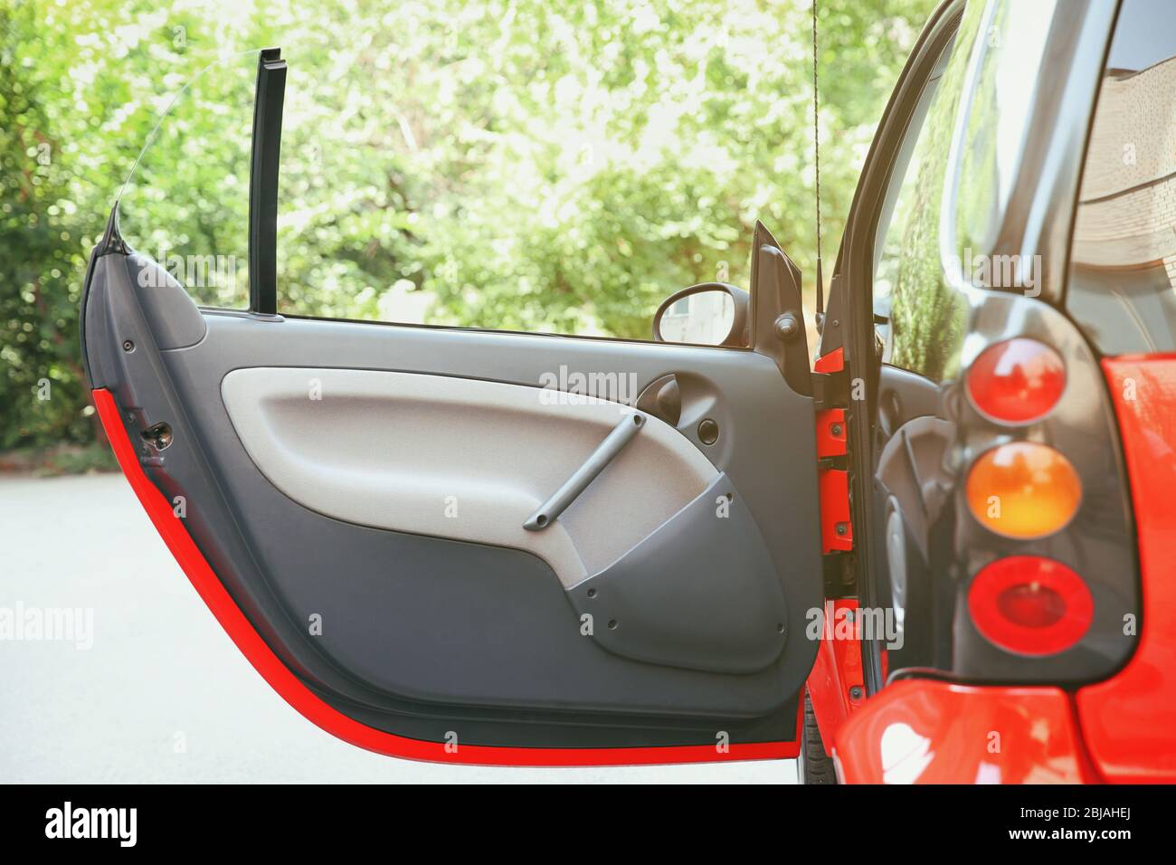 Open car door on street Stock Photo - Alamy