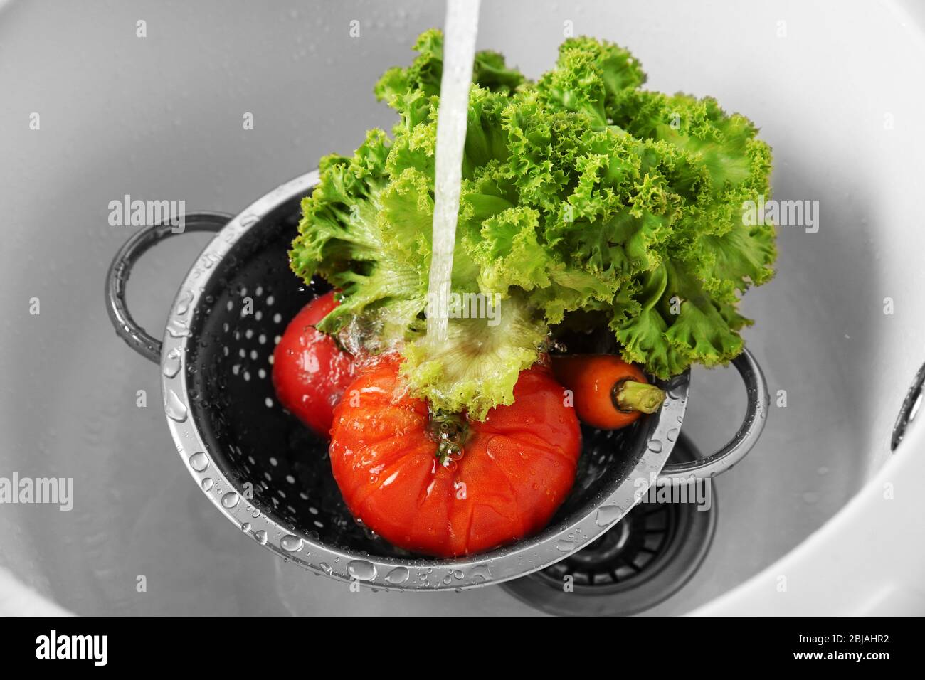 Fresh vegetables in kitchen sink Stock Photo - Alamy