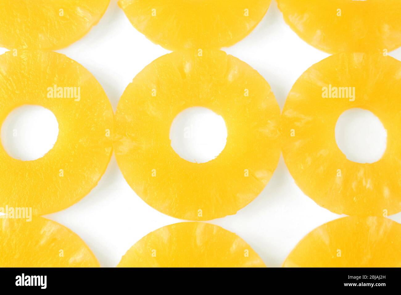 Pineapple ring slices background Stock Photo - Alamy