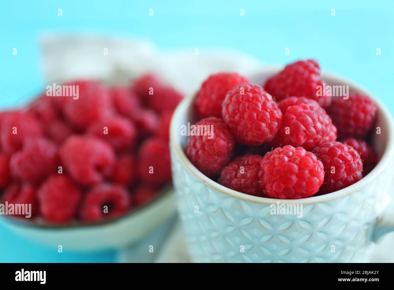 Fresh raspberry in cup hi-res stock photography and images - Alamy