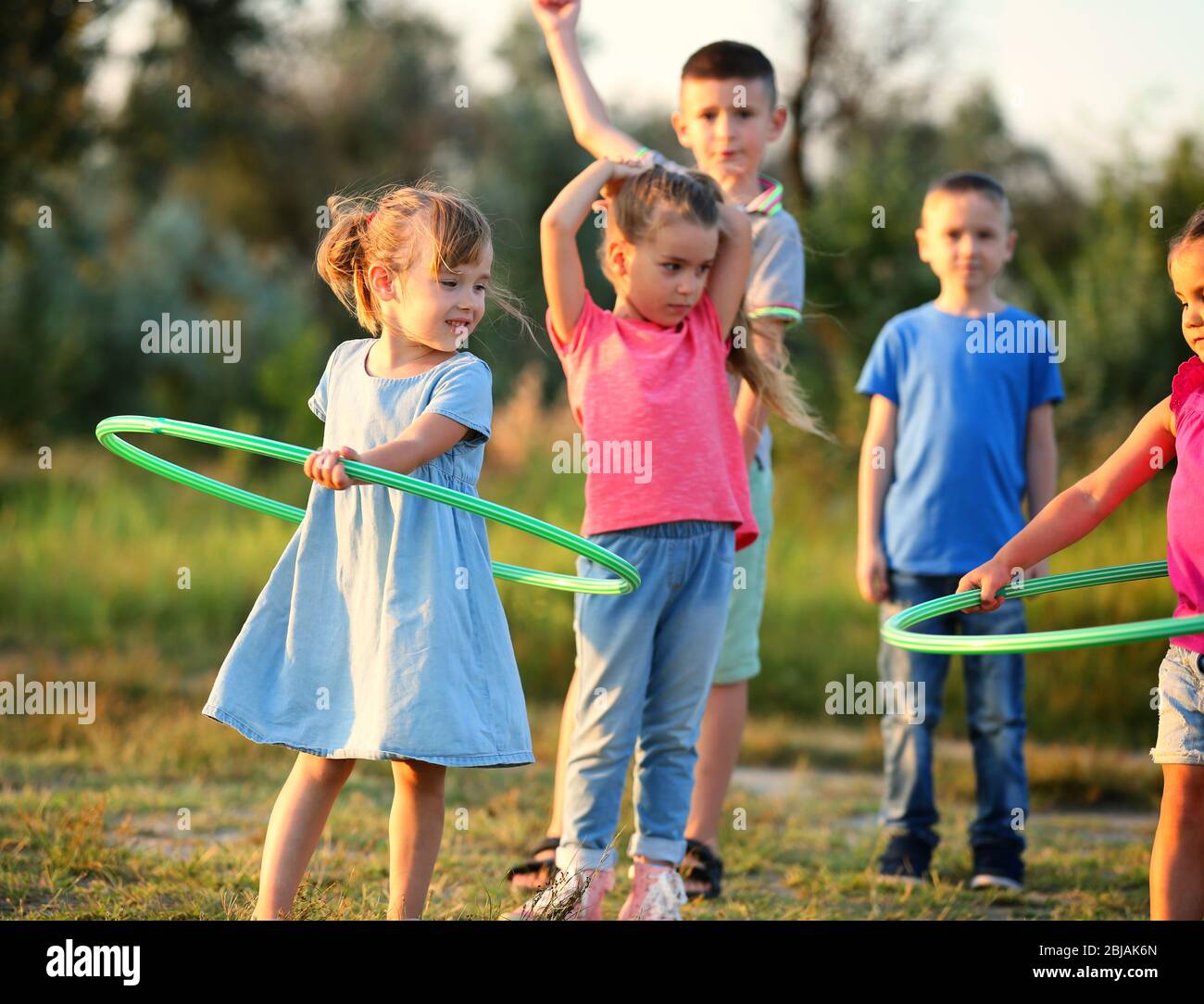 Happy kids playing in park Stock Photo - Alamy