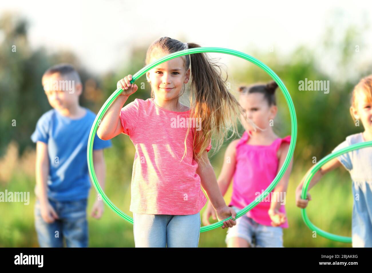 Happy kids playing in park Stock Photo - Alamy
