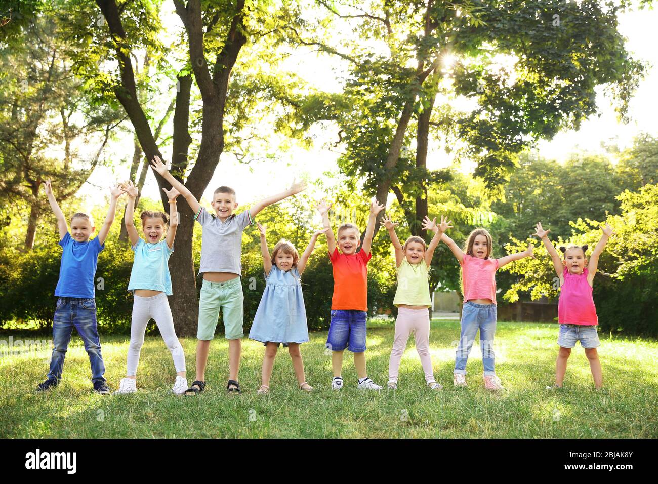 Group of happy kids in park Stock Photo - Alamy