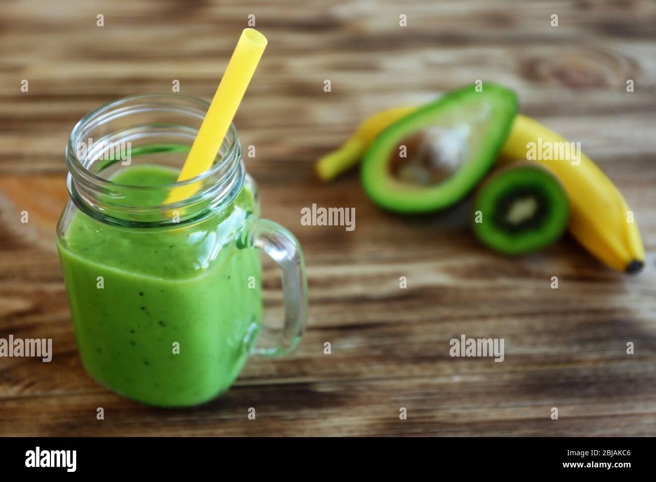 Fresh fruit cocktail on wooden background Stock Photo - Alamy