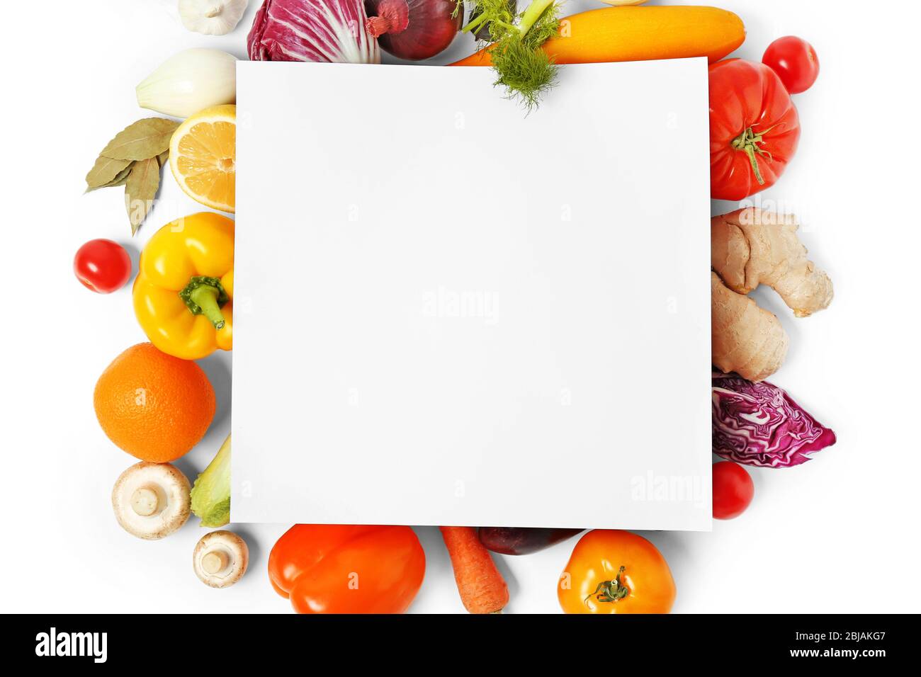 Vegetables and sheet of paper on white background Stock Photo - Alamy