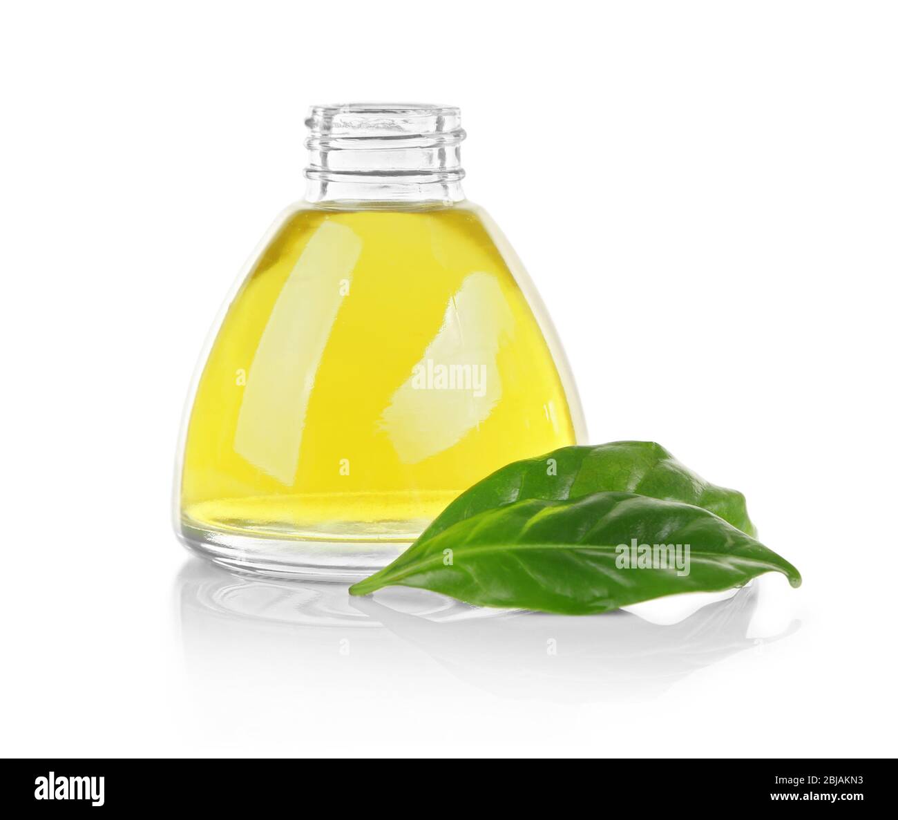 Tea oil in glass bottle, isolated on white Stock Photo - Alamy