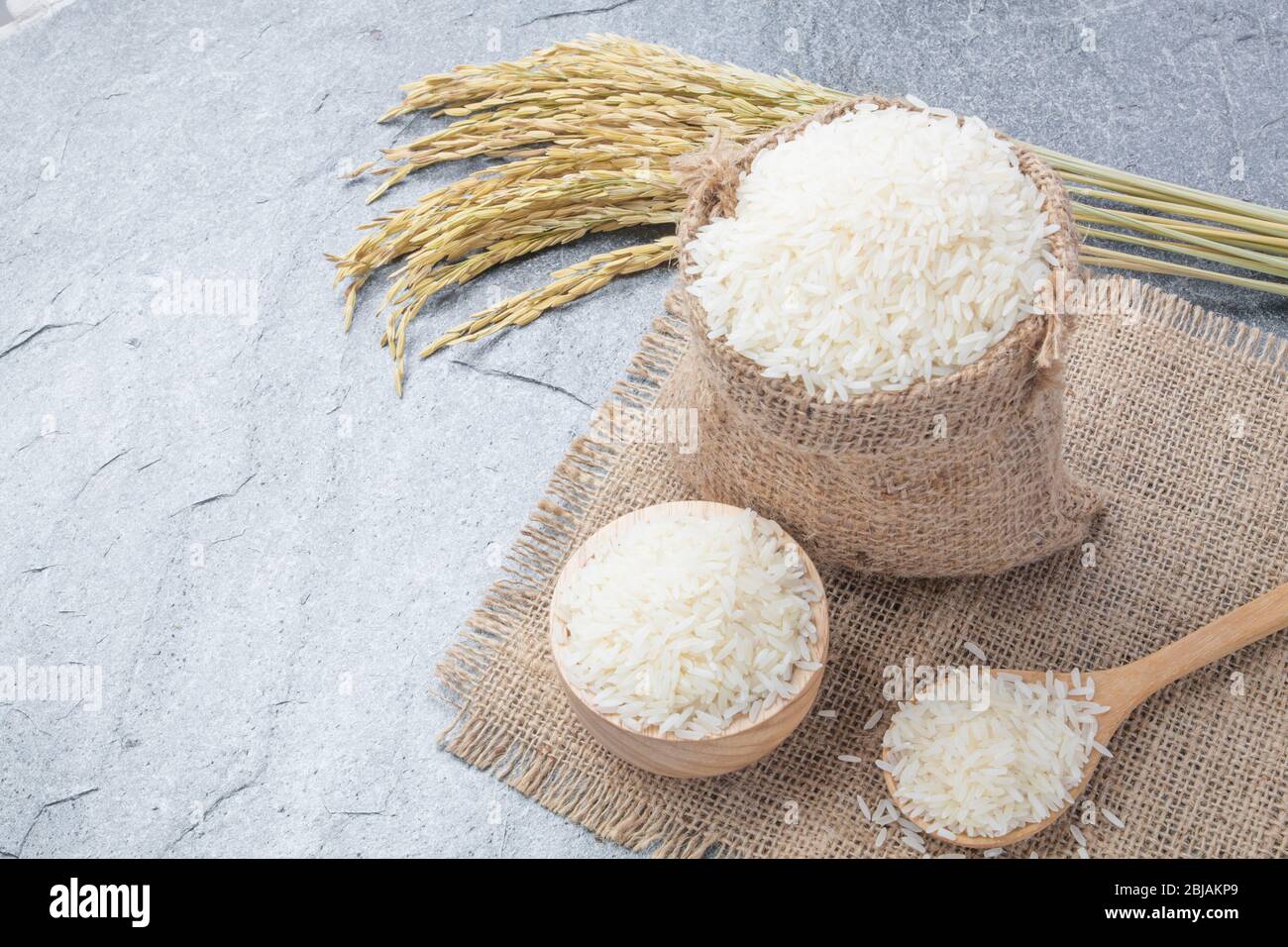 thai fragrant jasmine rice in a bowl with gold spike on Sack Stock ...
