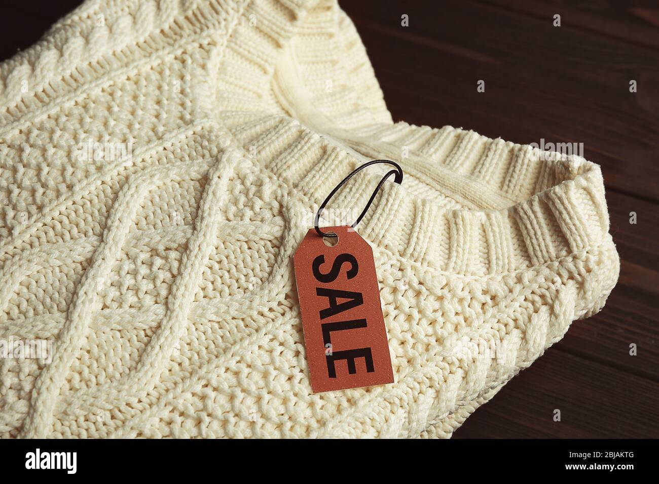 Sale label on sweater, closeup Stock Photo - Alamy