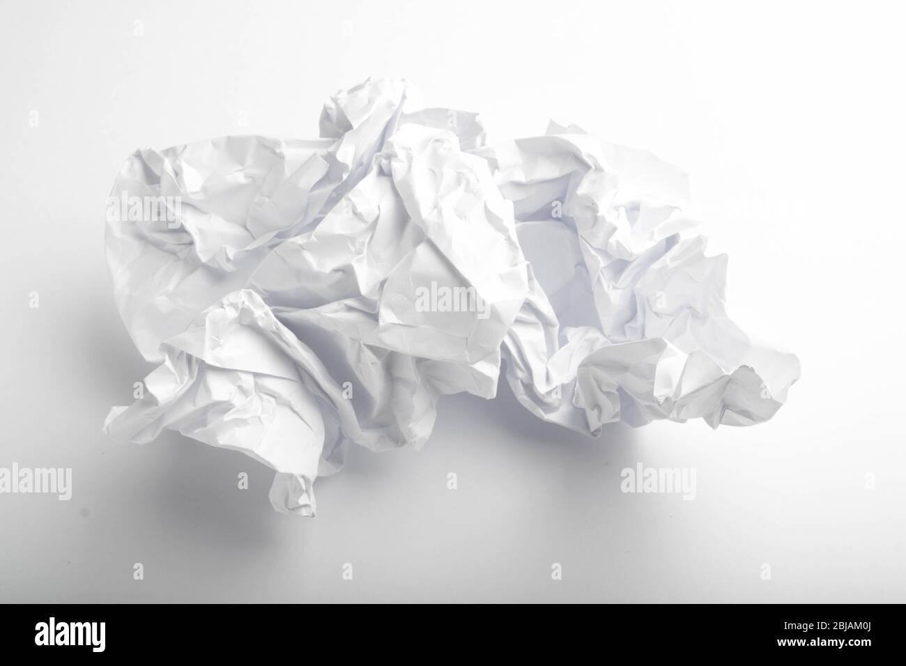 single page of crumpled paper on white background Stock Photo - Alamy