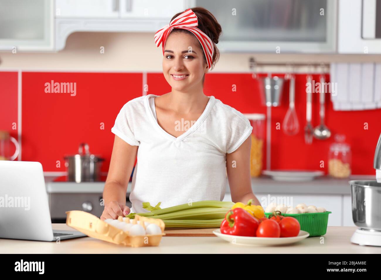 Beautiful girl cooking on kitchen. Food blogger concept Stock Photo - Alamy