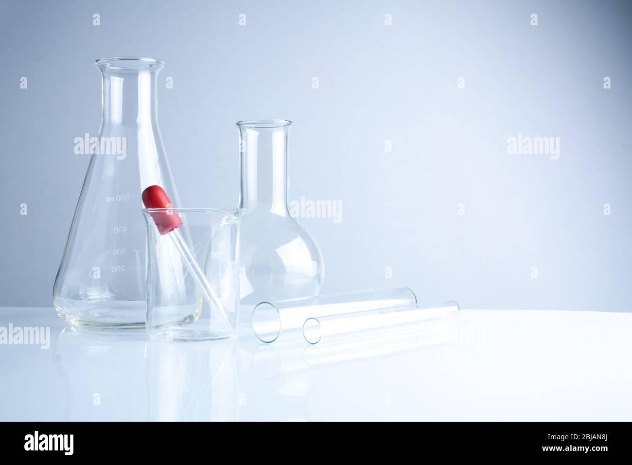 Group of laboratory glassware on table, Symbolic of science research ...