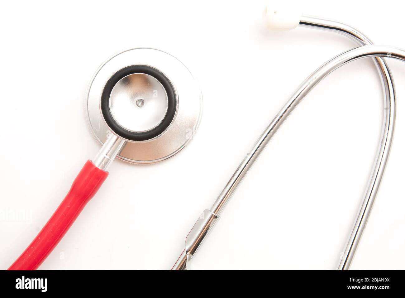 Close -up red stethoscope on white background Stock Photo - Alamy