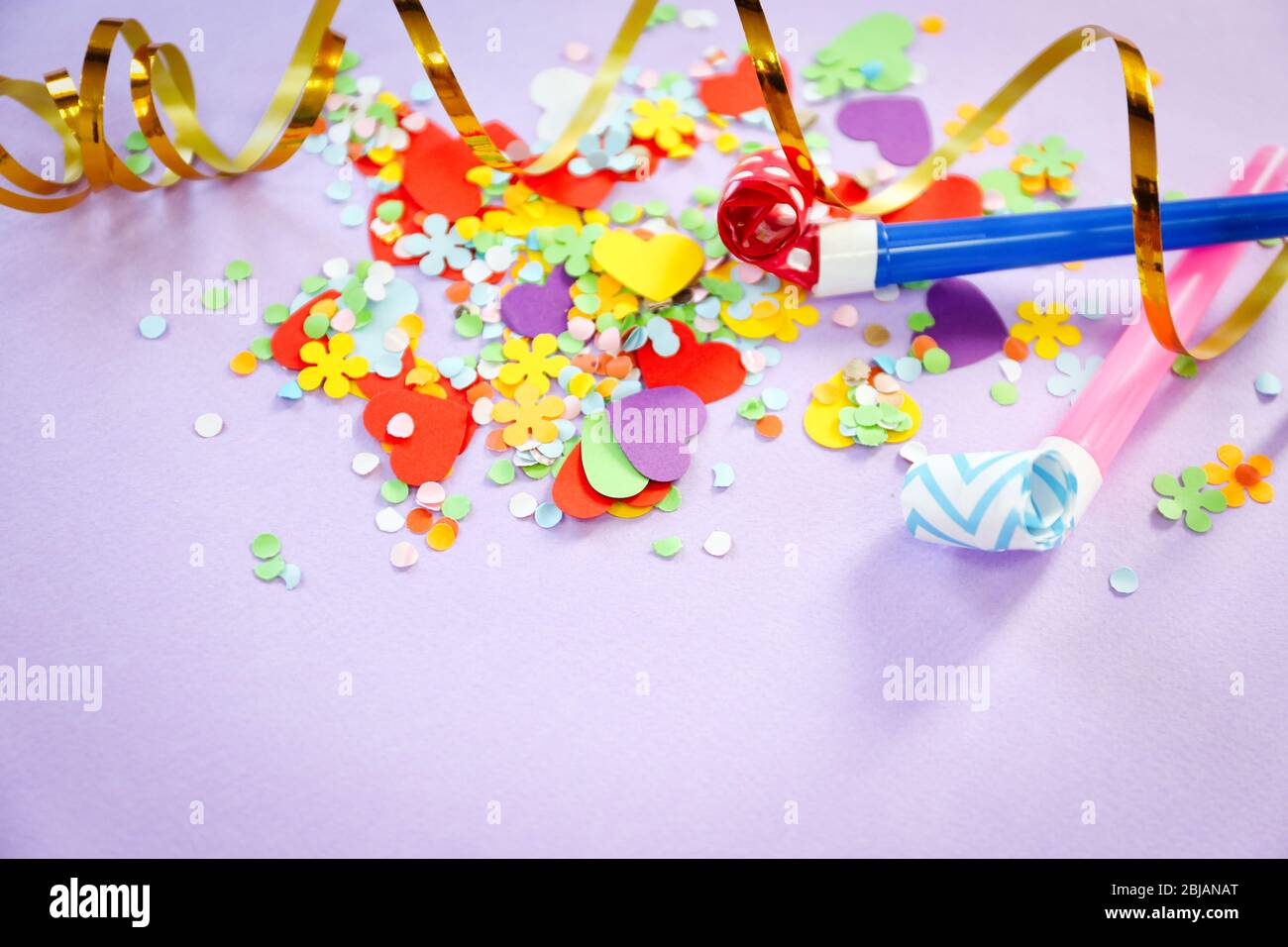 Holiday pipes and decor on lilac background Stock Photo - Alamy