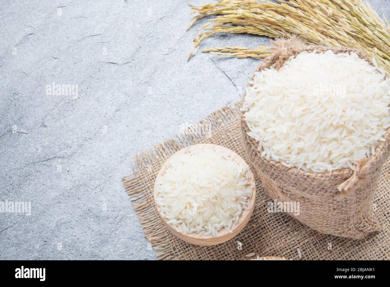 thai fragrant jasmine rice in a bowl with gold spike on Sack Stock ...