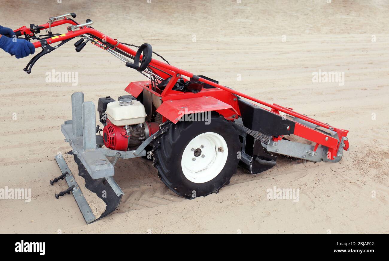 Beach cleaner machine on the seacoast Stock Photo - Alamy