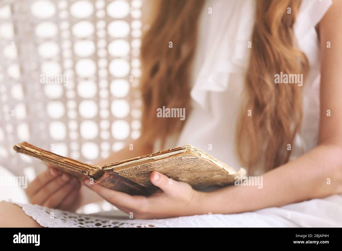 Woman reading old book Stock Photo - Alamy