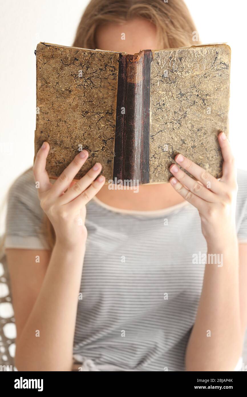 Woman reading old book Stock Photo - Alamy