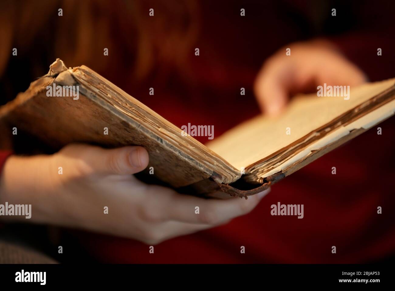 Woman reading old book Stock Photo - Alamy