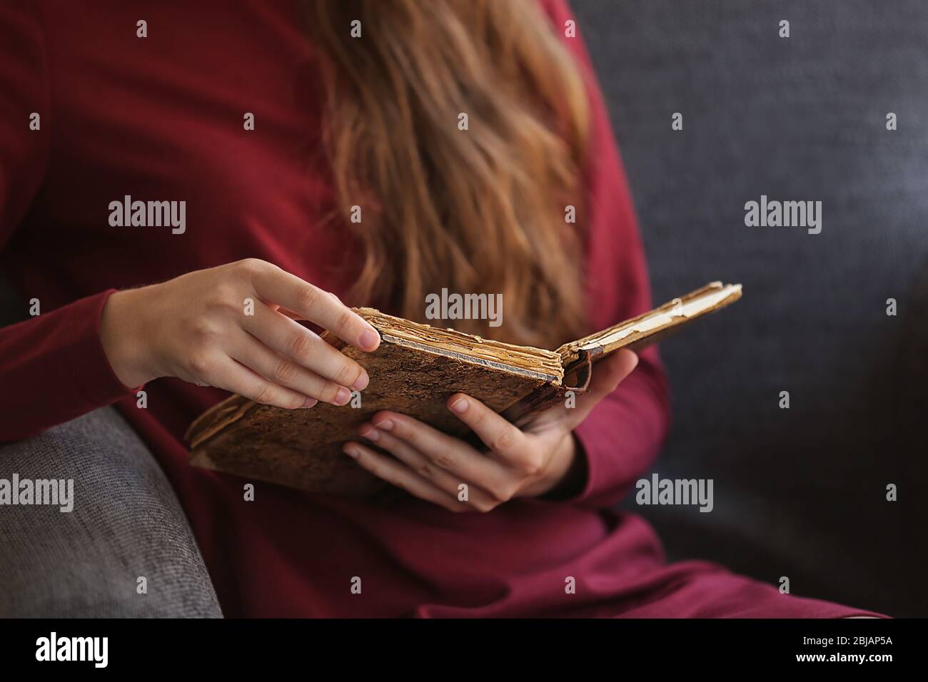 Woman reading old book Stock Photo - Alamy