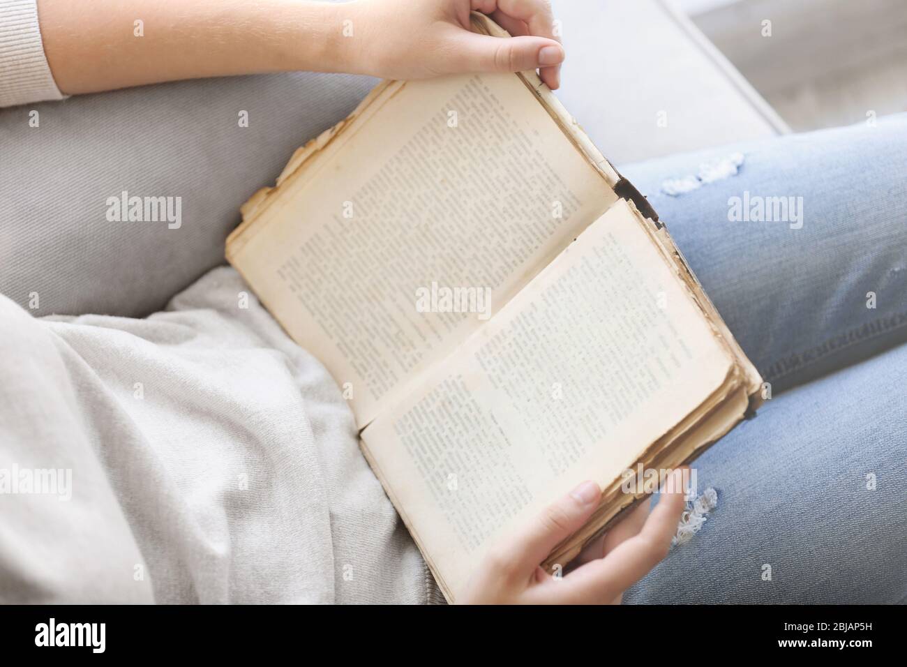 Woman reading old book Stock Photo - Alamy