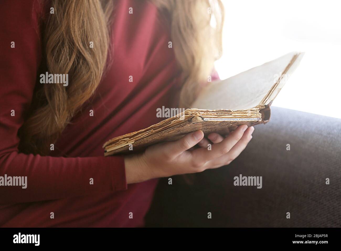 Woman reading old book Stock Photo - Alamy