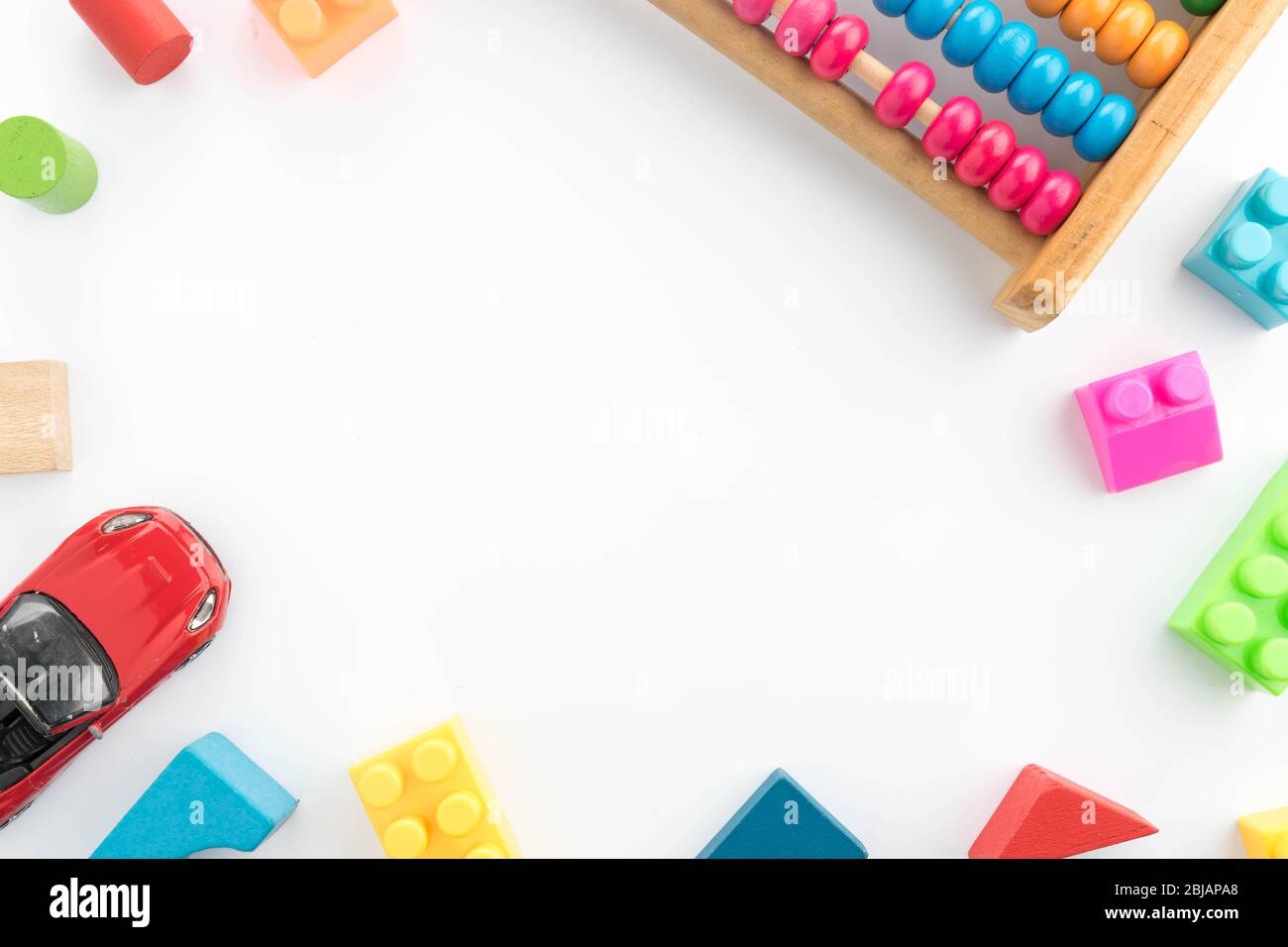 Kids toys frame on isolated white background Stock Photo - Alamy