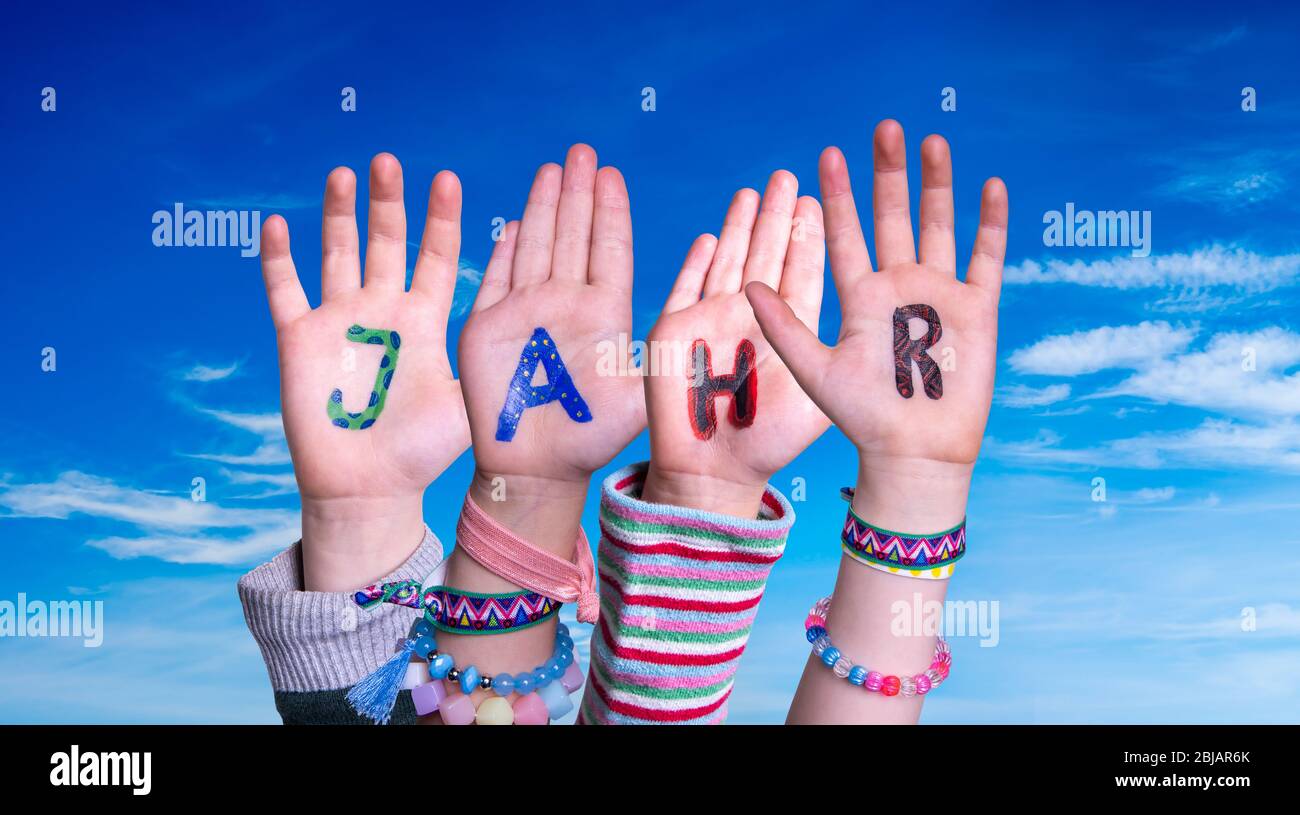 Children Hands Building Word Jahr Means Year, Blue Sky Stock Photo - Alamy