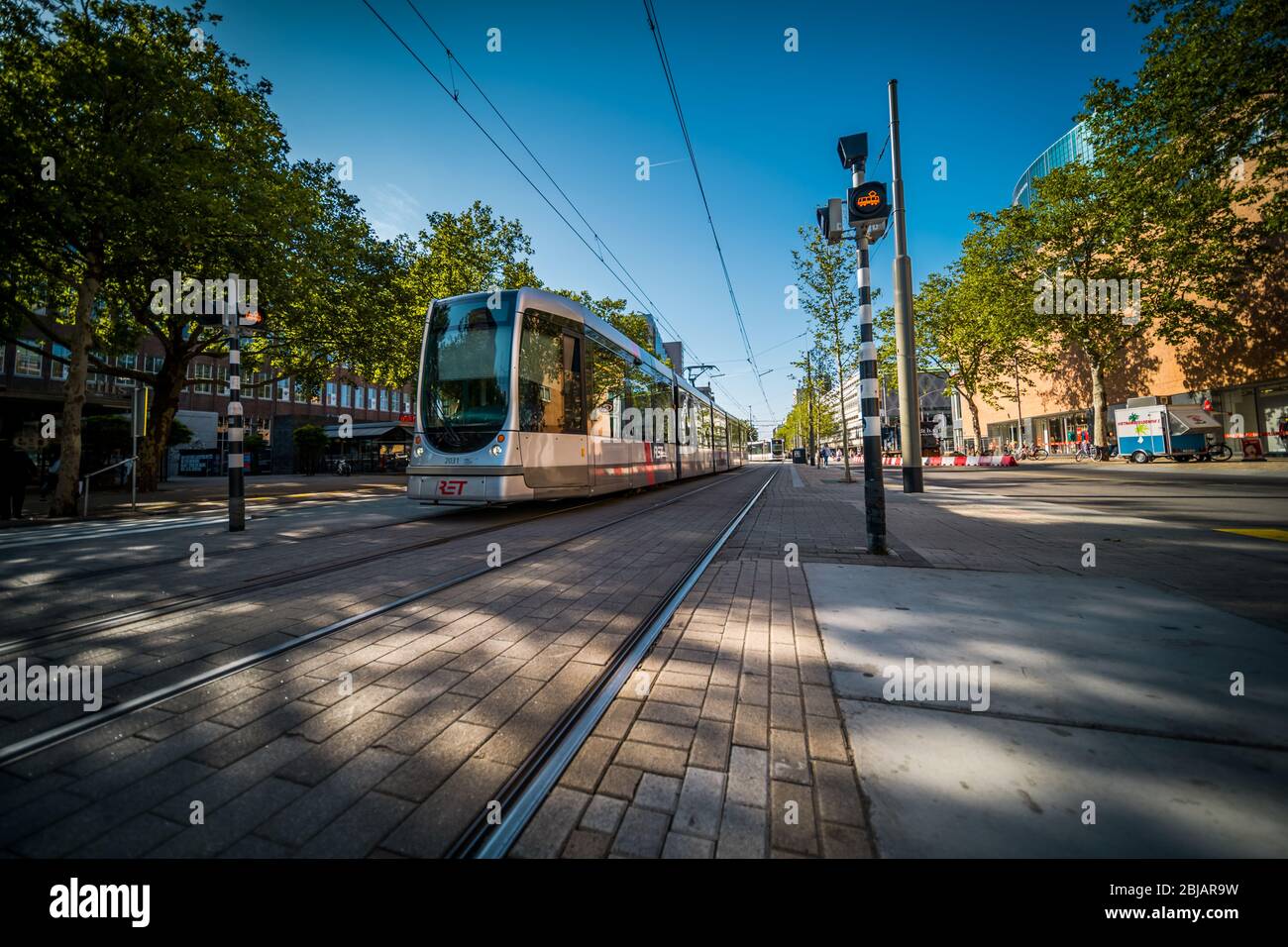 The electric tram passing by on the coolsingel downtown Rotterdam City ...