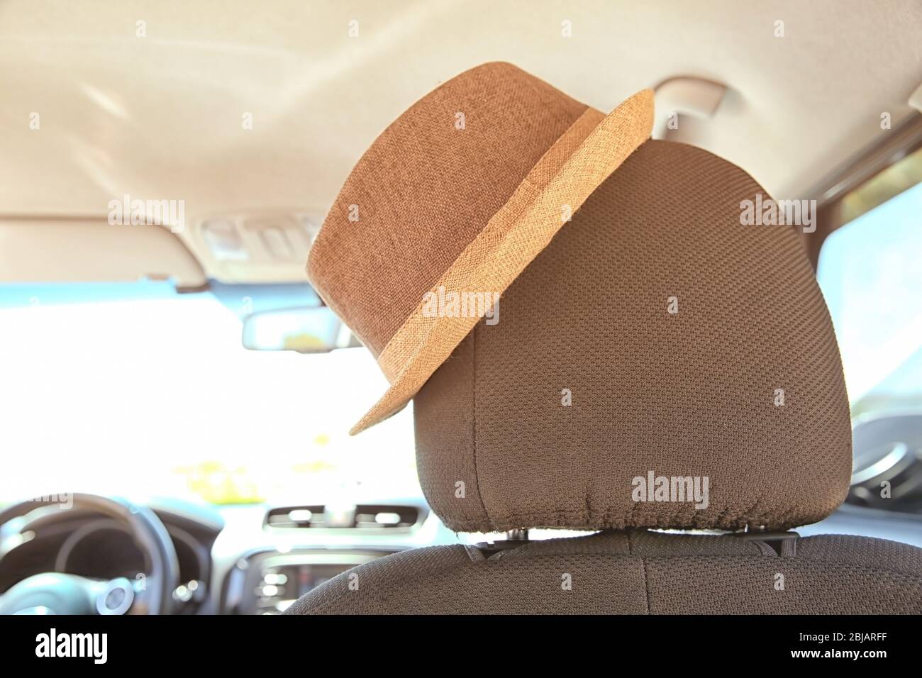 Hat on car seat head Stock Photo - Alamy