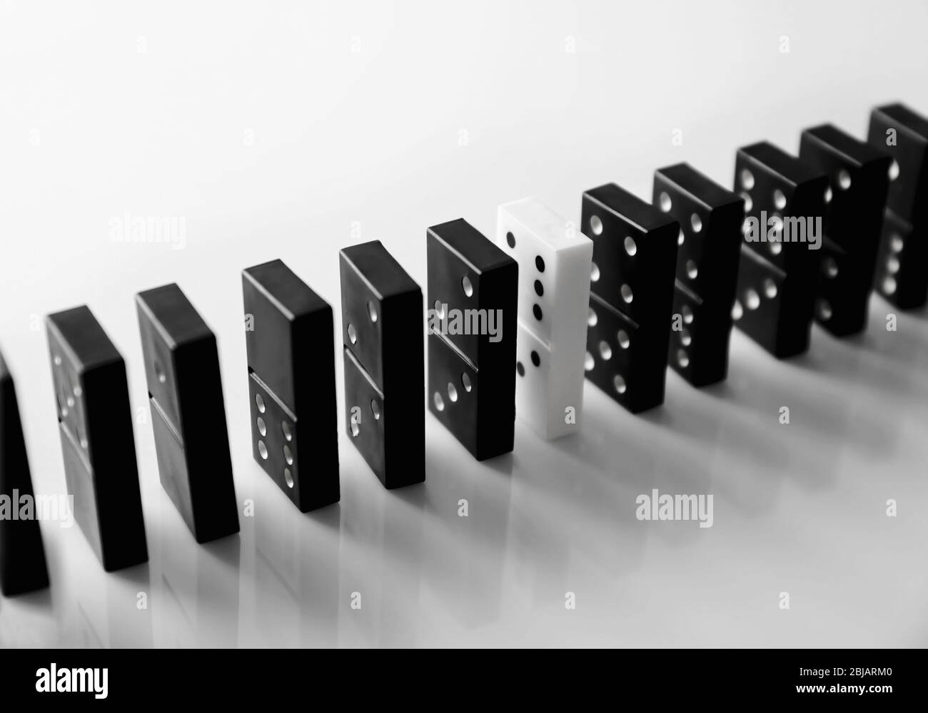 Dominoes on light background Stock Photo - Alamy