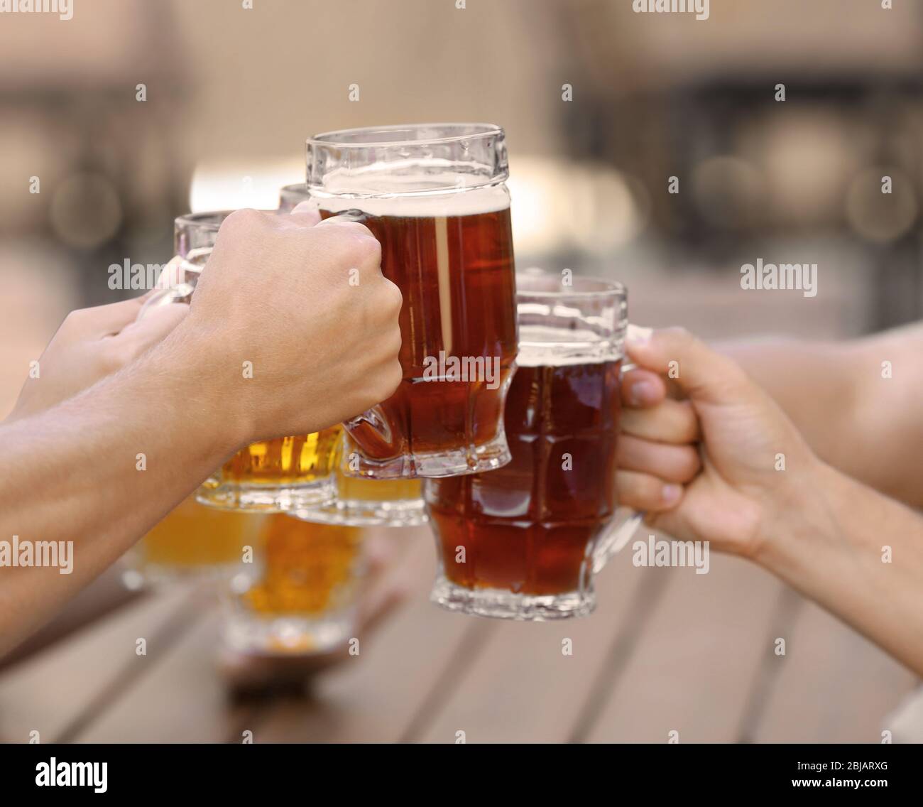 People drinking beer in cafe Stock Photo - Alamy