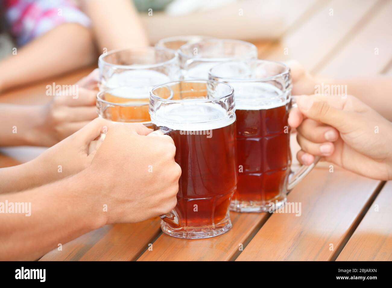 People drinking beer in cafe Stock Photo - Alamy