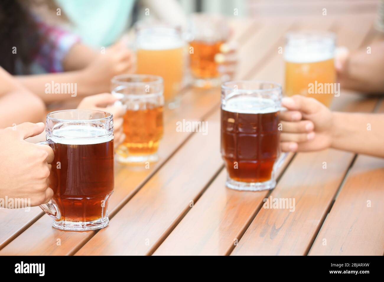 People drinking beer in cafe Stock Photo - Alamy