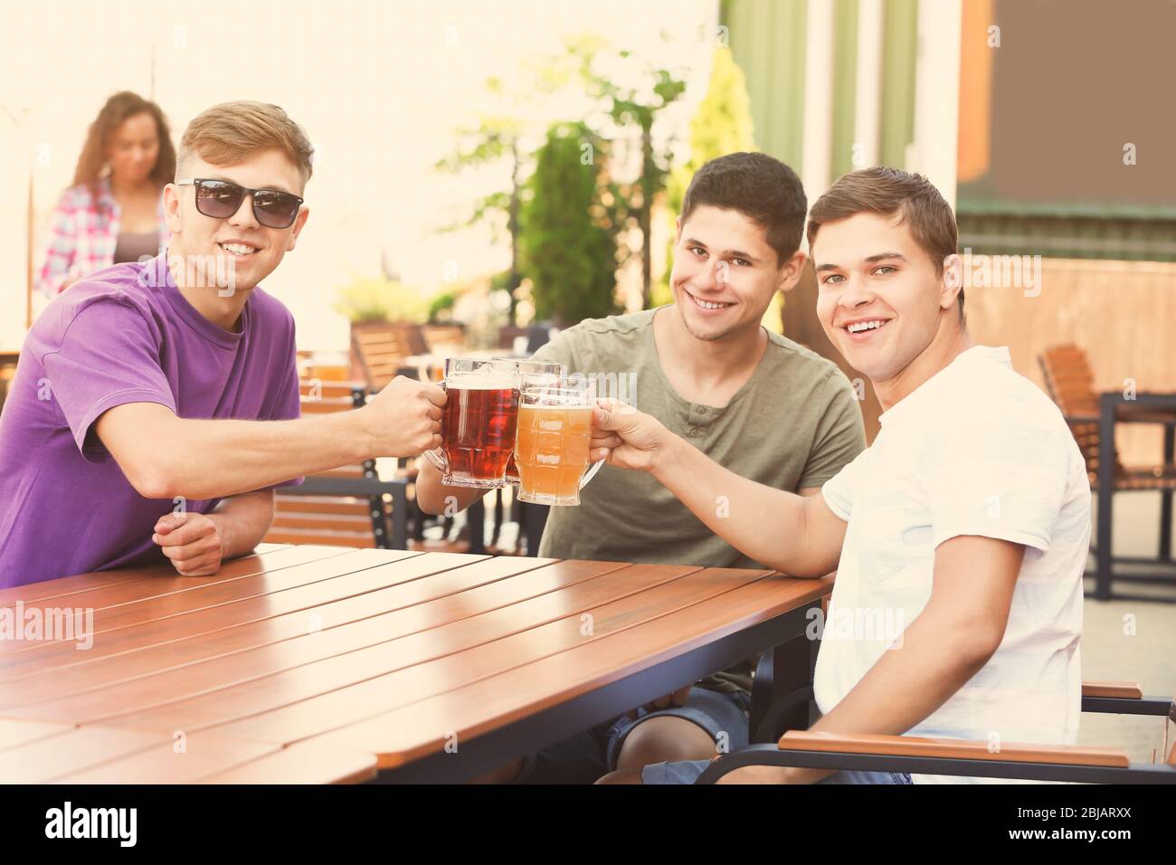 Guys drinking beer in pub Stock Photo - Alamy