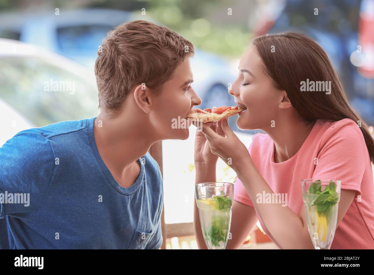 Caucasian teen female eating pizza hi-res stock photography and images ...